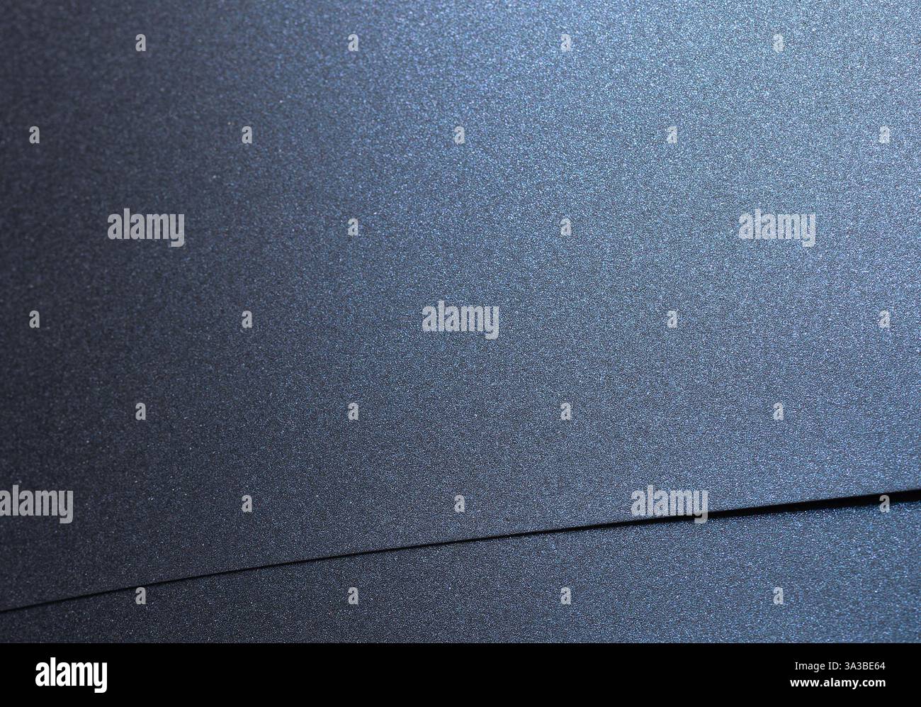 Navy blue paper background with a smooth, glossy texture and a ...