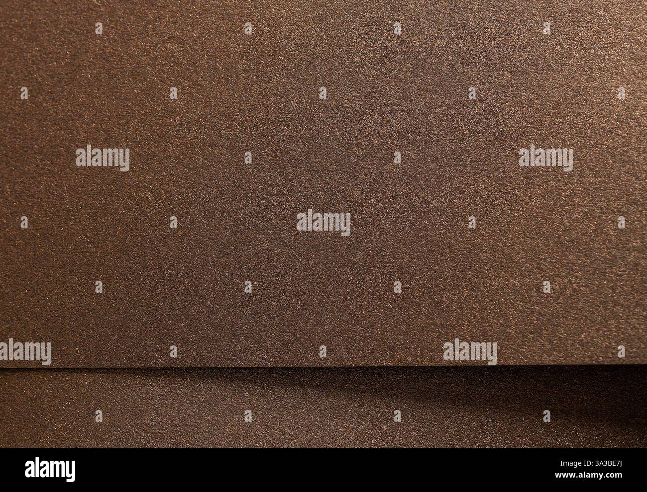 Warm gold and bronze paper background with a pearlescent, metallic ...