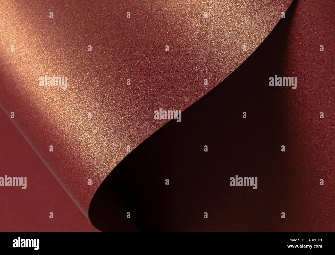 Burgundy paper background with a glossy, pearlescent texture and ...