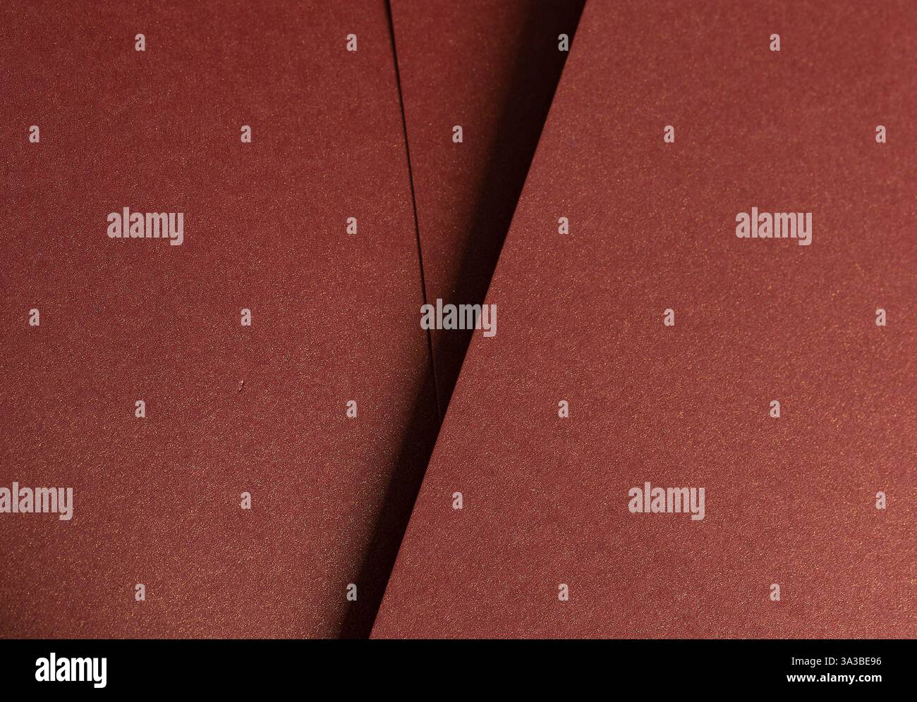 Burgundy paper background with a smooth texture and subtle shimmer ...
