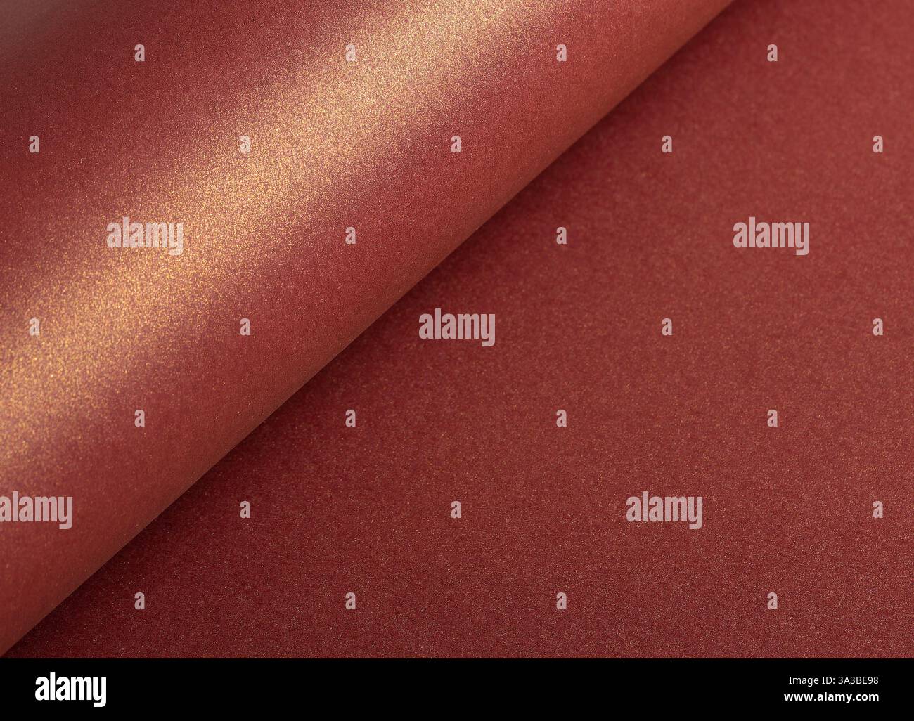 Burgundy paper background with a glossy, pearlescent texture and subtle ...