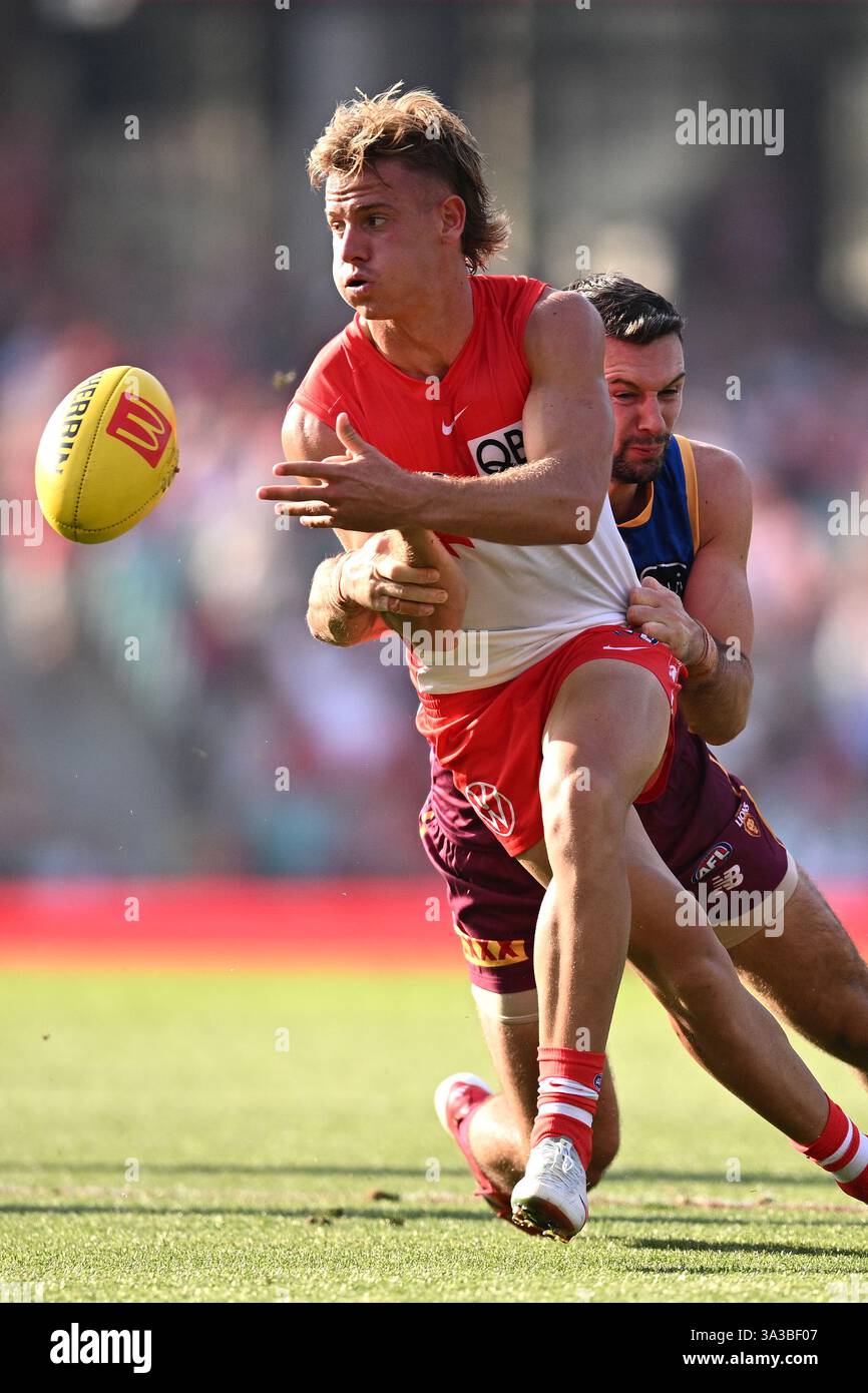 Sydney, Australia. 15th Mar, 2025. Corey Warner of the Swans handballs ...