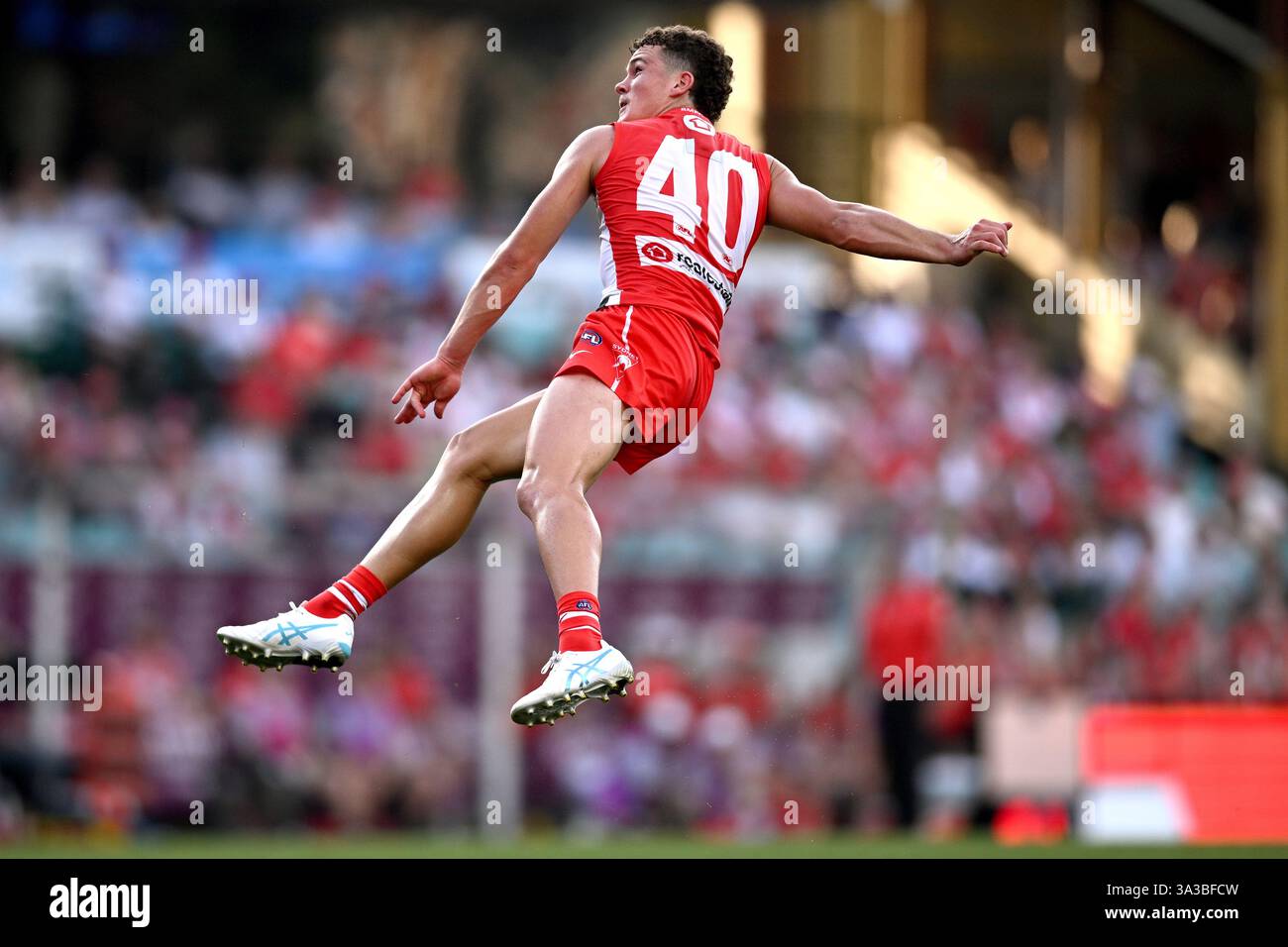 Sydney, Australia. 15th Mar, 2025. Tom Hanily of the Swans kicks a goal ...