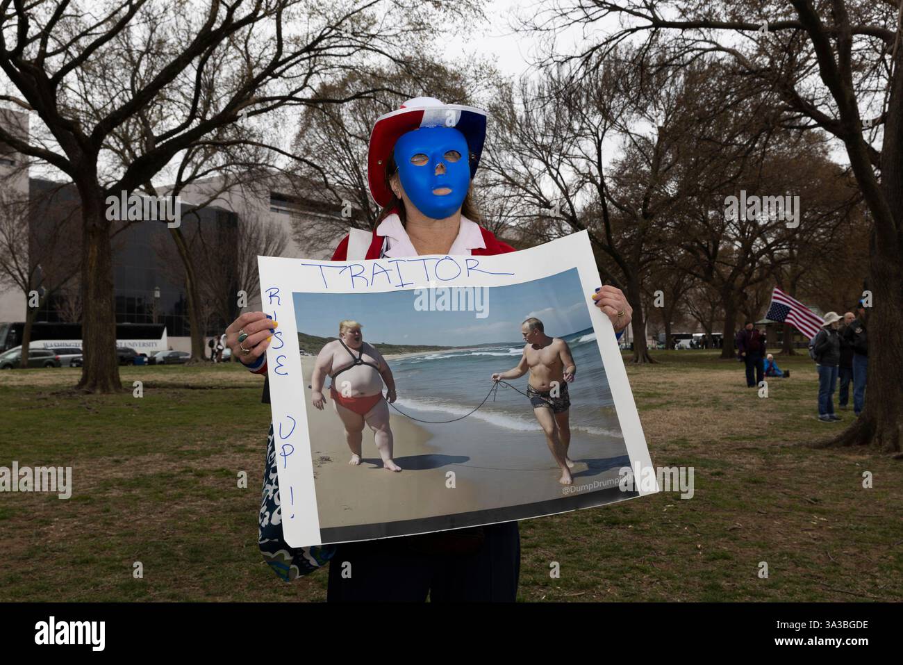 A demonstrator holds a sign during "Veterans March" at the National ...