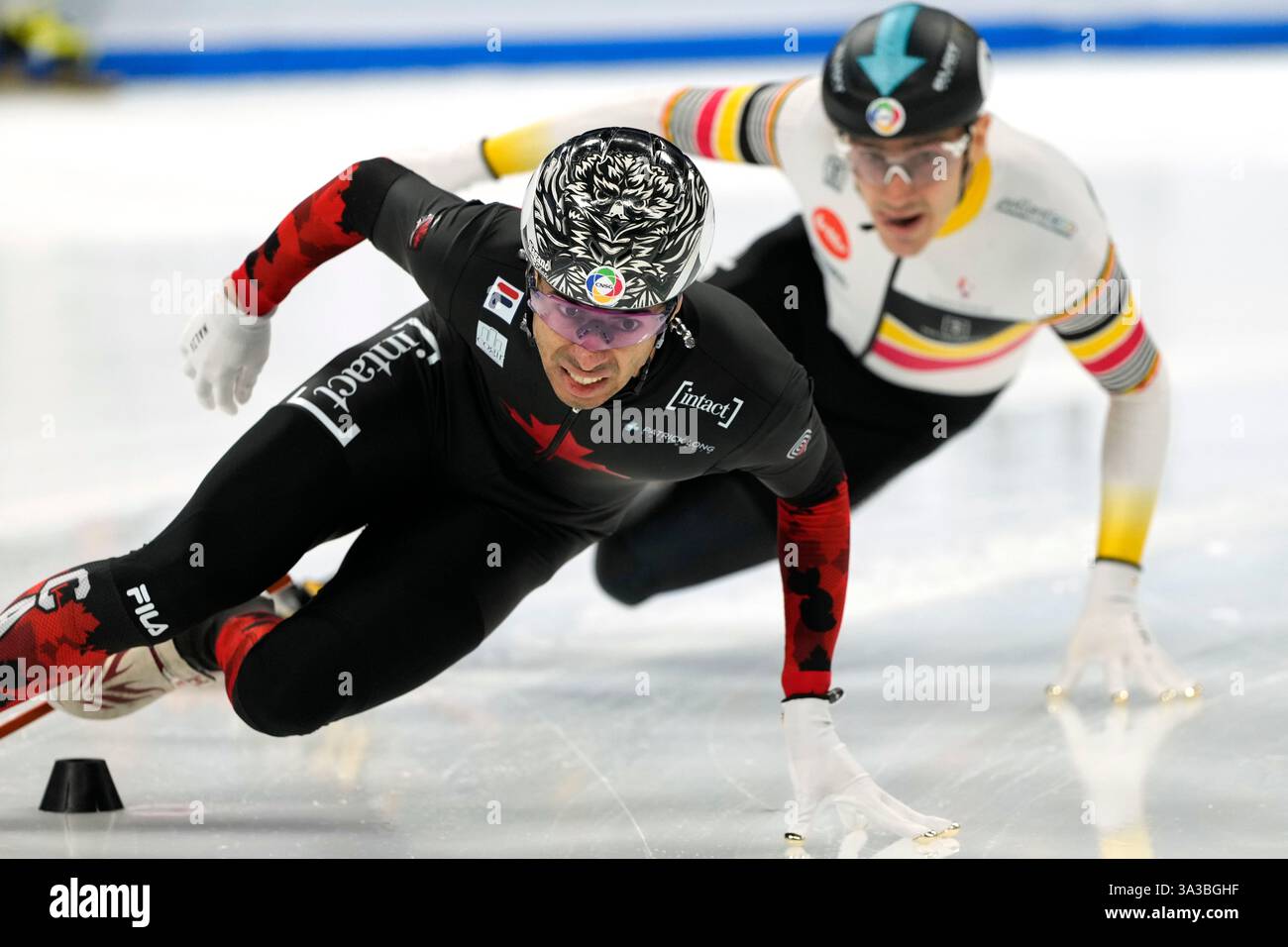 Canada's William Dandjinou leads ahead of Belgium's Stijn Desmet, right ...