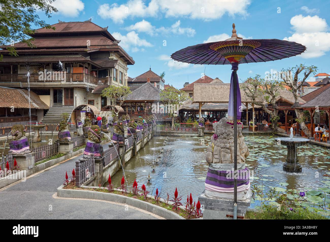 Intricately carved stone statues and lotus pond at Saraswati Temple ...