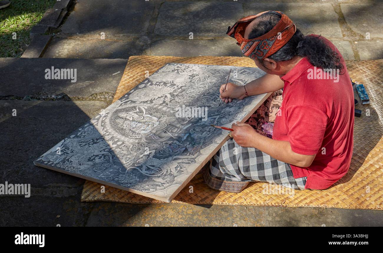 Balinese painter works outdoors at Puri Lukisan Museum in Ubud, Bali ...