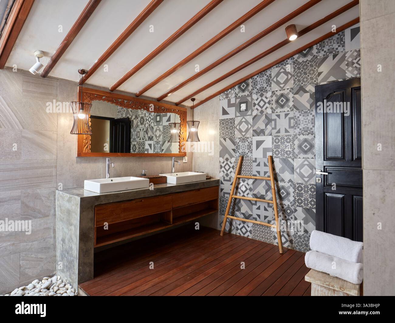 Interior view of tropical bathroom in the room at an upscale hotel ...