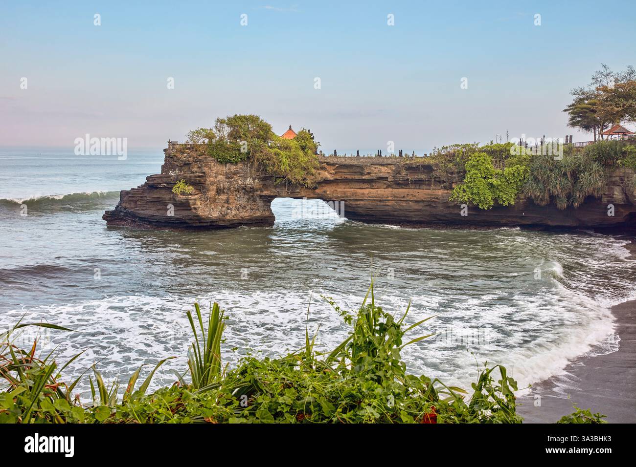 Batu Bolong Temple (Pura Batu Bolong), a Hindu temple built on a large ...
