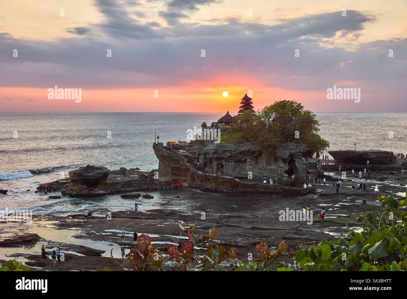 Exterior view of the iconic Tanah Lot island temple at sunset. Bali ...