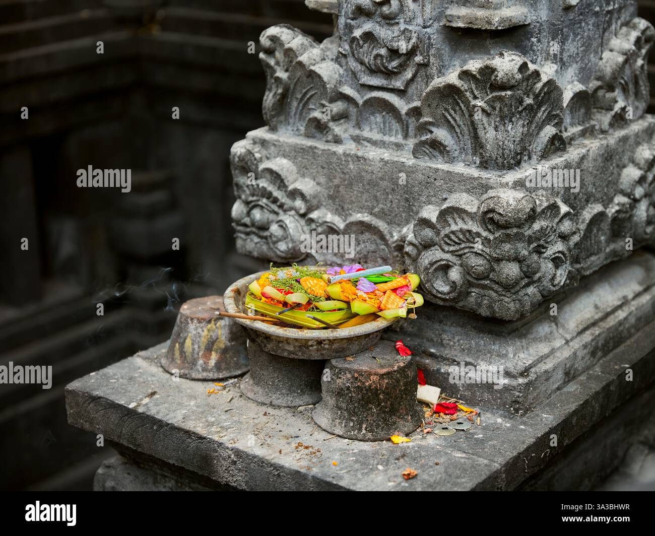 Traditional Balinese offerings on a small altar at Tanah Lot Temple ...