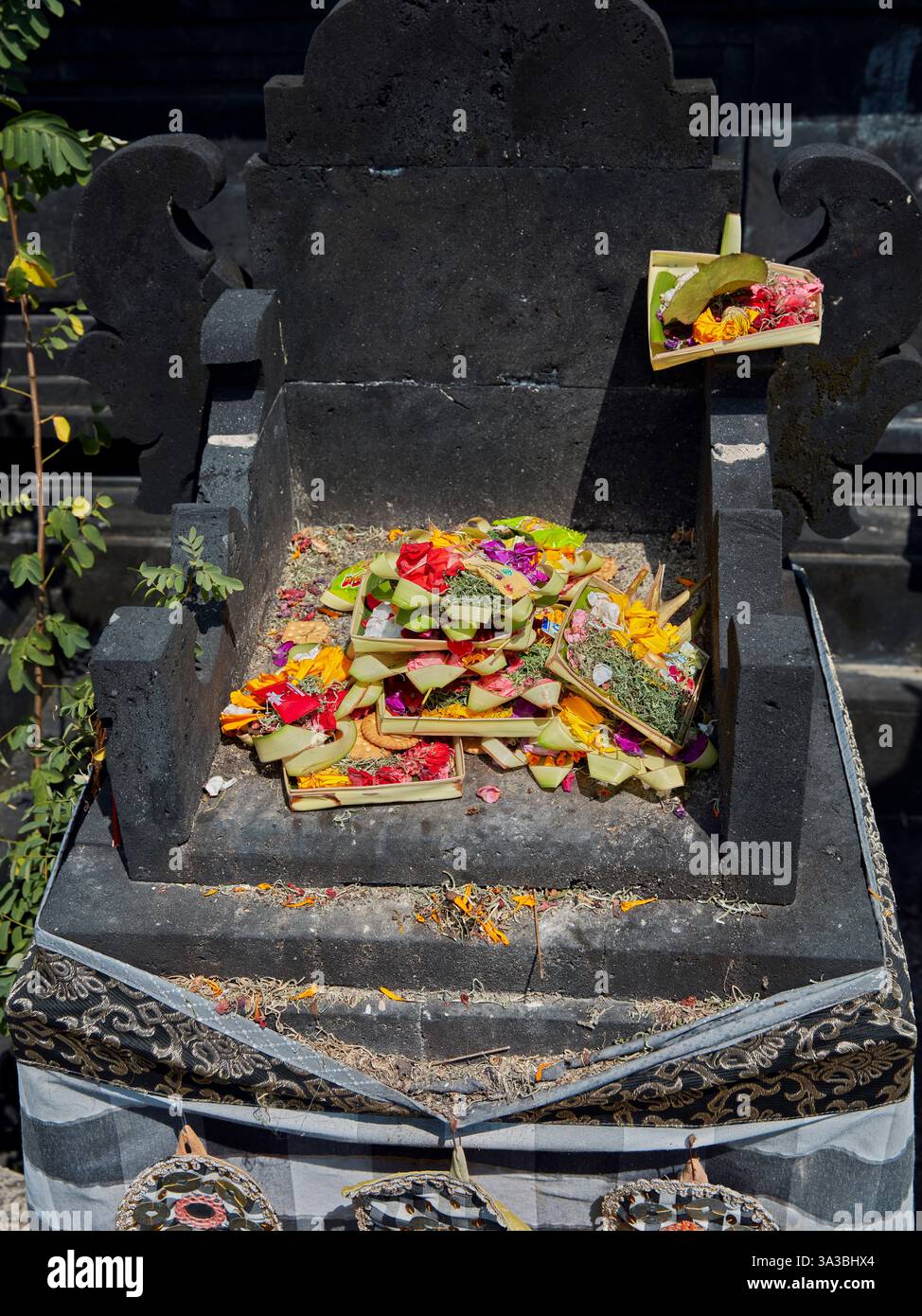 Traditional Balinese offerings on a small altar at Tanah Lot Temple ...