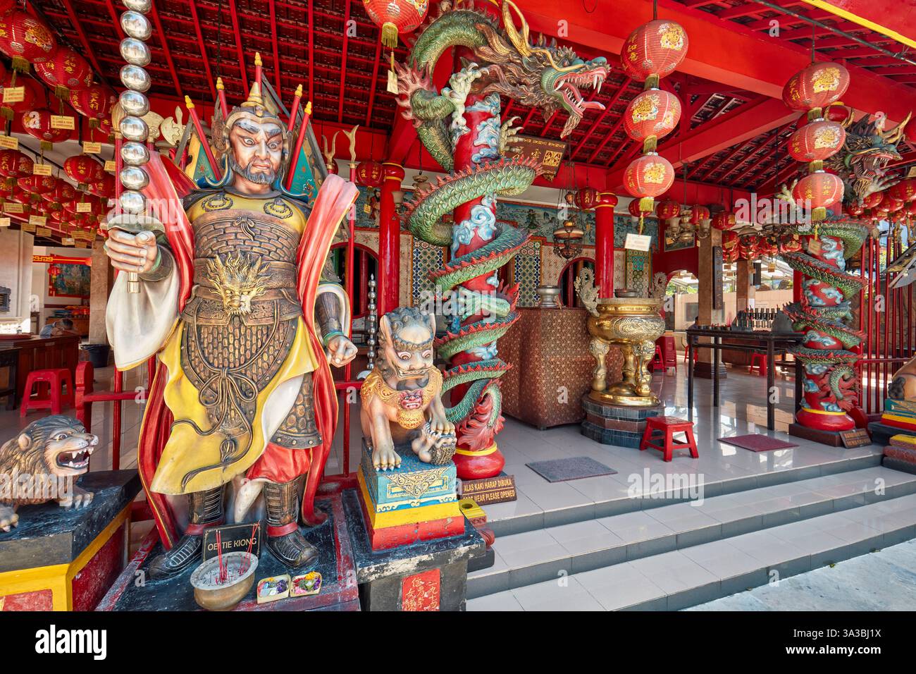 Intricately carved colorful statues at the main building (Baktisala) of ...