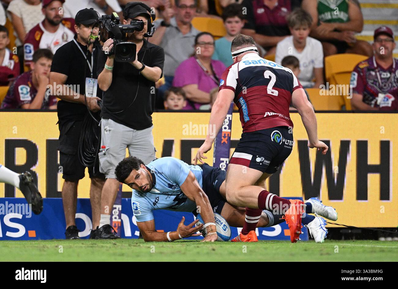 Triston Reilly of the Waratahs scoring a try during the Super Rugby ...