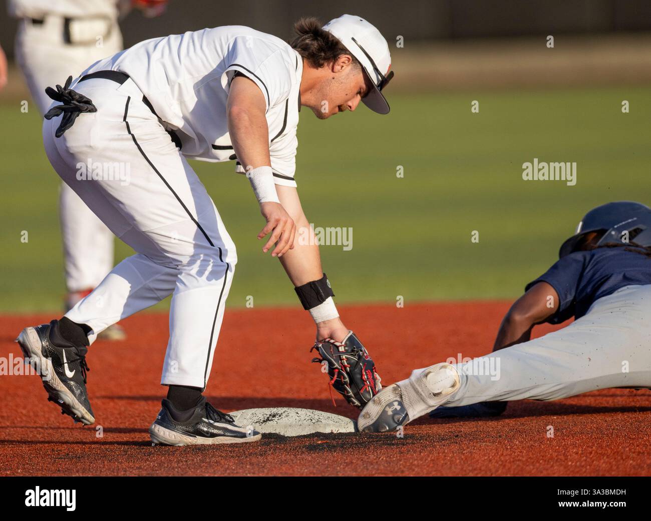 UT Martin second baseman TJ Grines (3) keeps his foot on the bag after ...