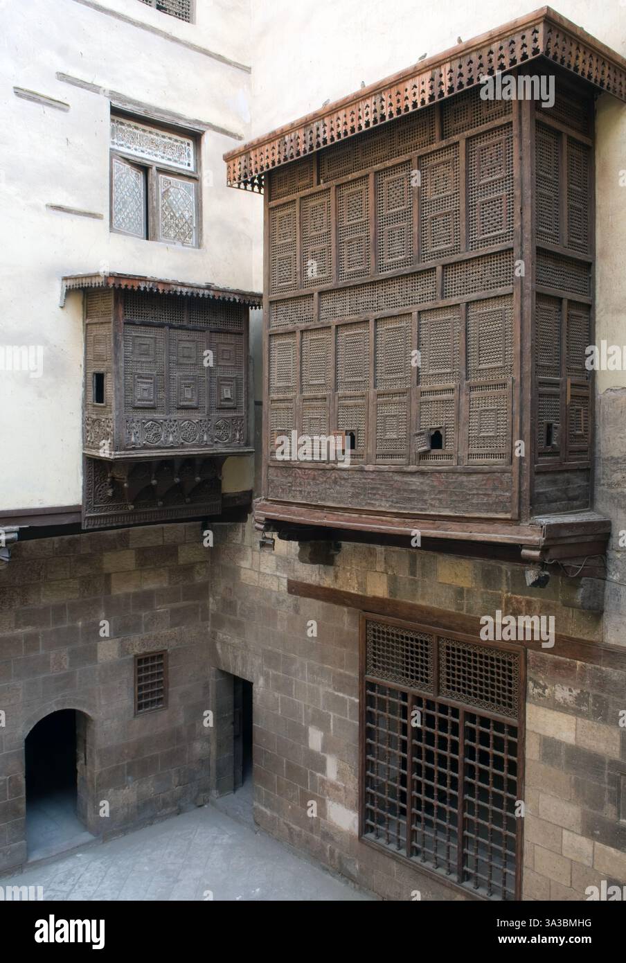 Egyptian style Mashrabiya window enclosed with carved wood latticework ...