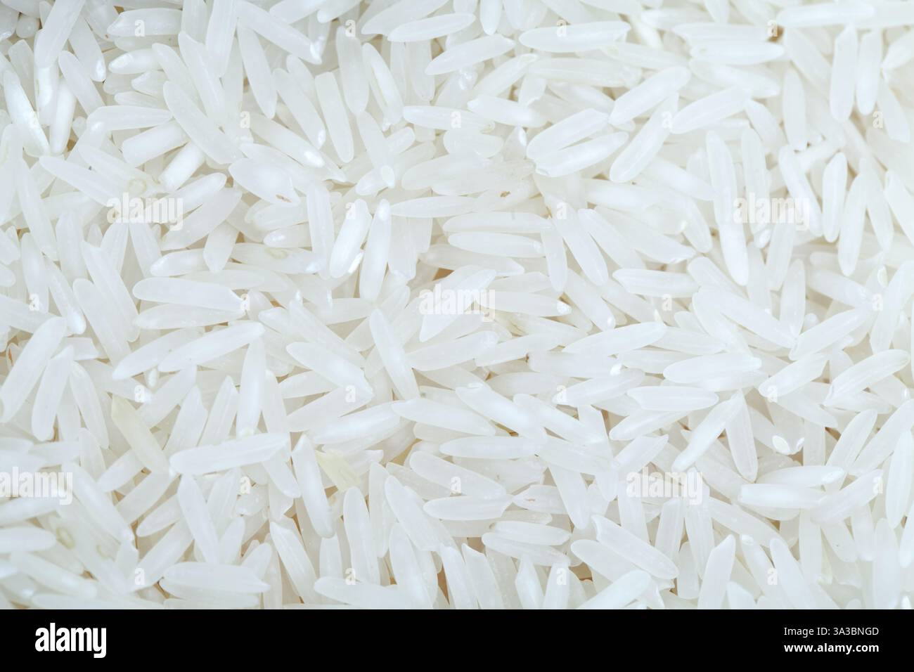 White dry rice food background Stock Photo - Alamy
