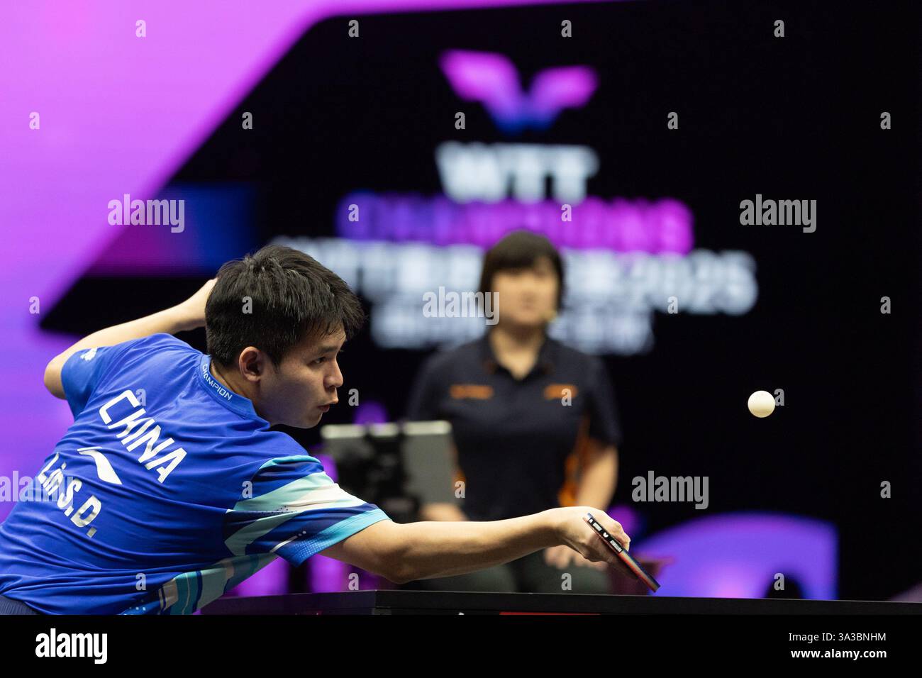 Chongqing, China. 15th Mar, 2025. Lin Shidong hits a return during the ...