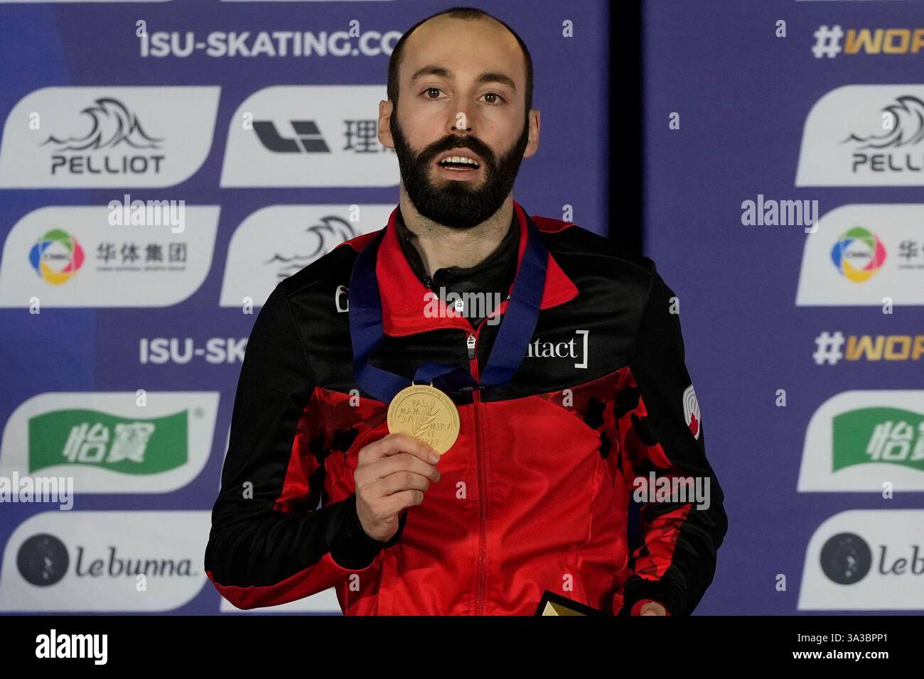 Gold medalist Canada's Steven Dubois celebrates on the podium after the ...