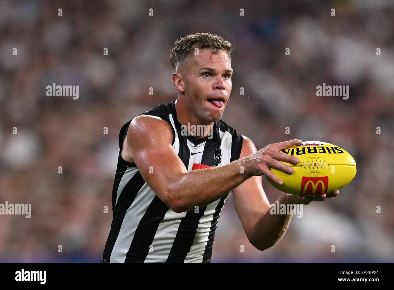Melbourne, Australia. 15th Mar, 2025. Dan Houston of Collingwood marks ...