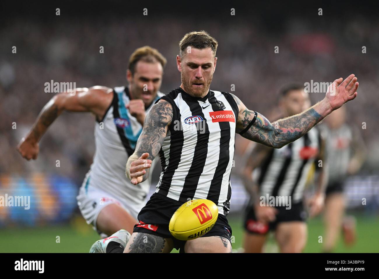Tim Membrey of Collingwood kicks the footy during the AFL Round 1 match ...