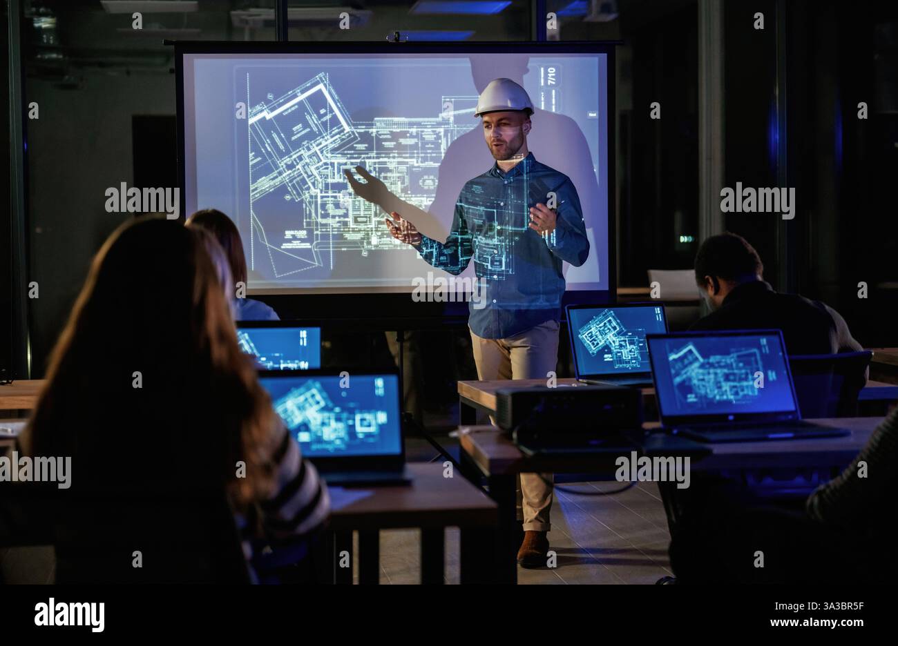 Explaining stuff. Male architect is showing construction site project ...