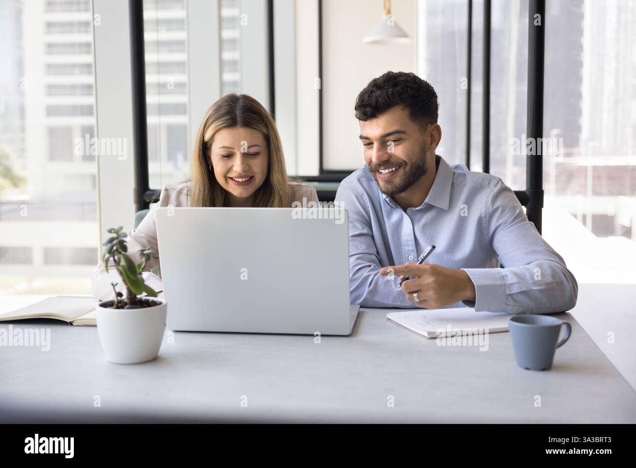 Two teammates working on joint hi-res stock photography and images - Alamy