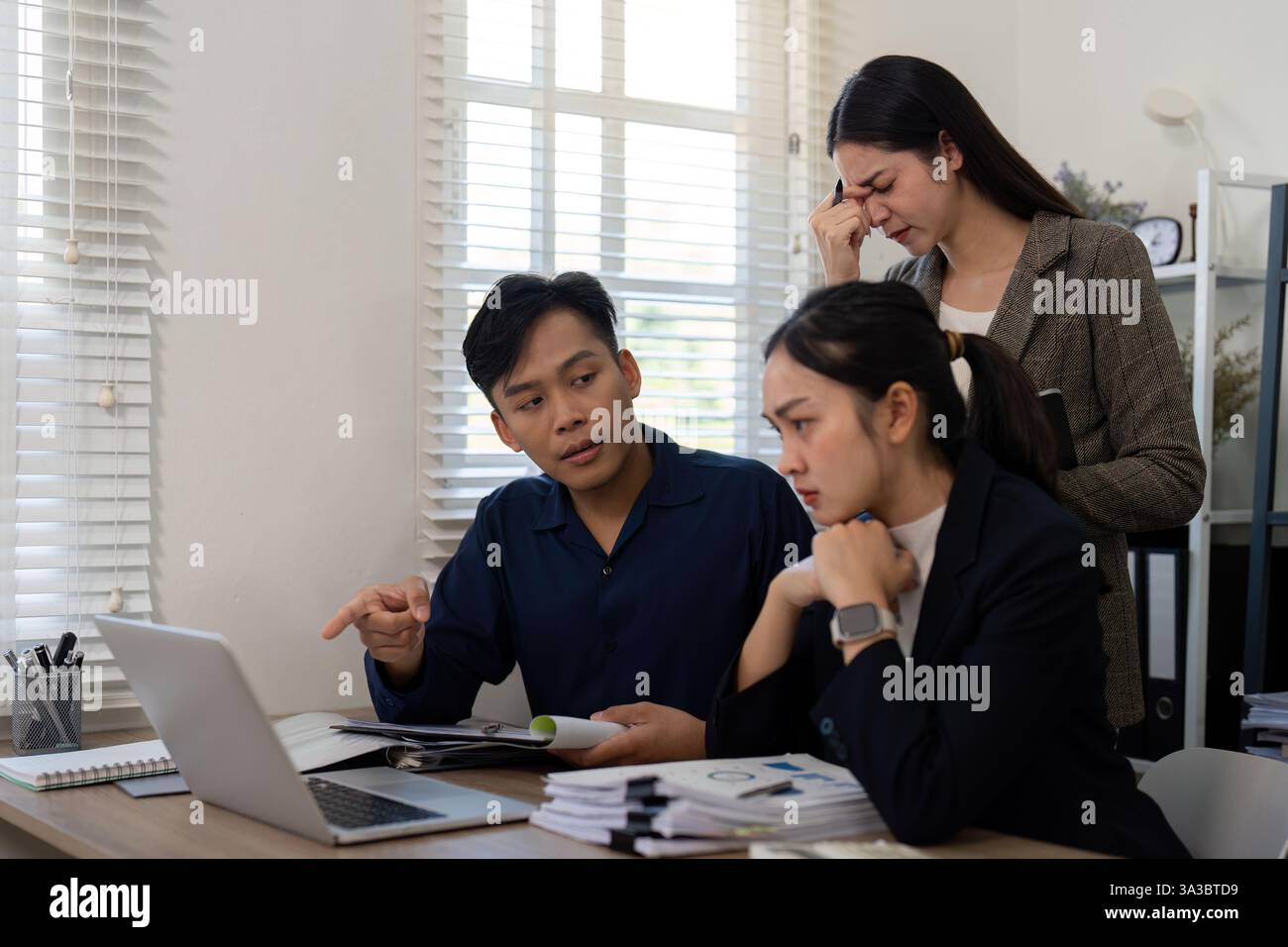 Communication and Issue Resolution. A professional team discusses their ...