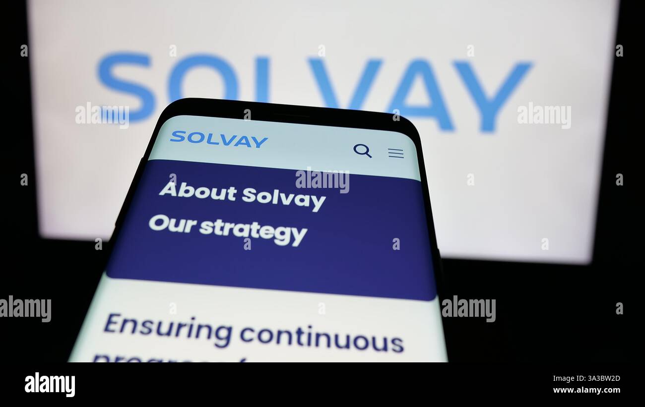 In this photo illustration, a smartphone with the website of Belgian chemical company Solvay S.A ...