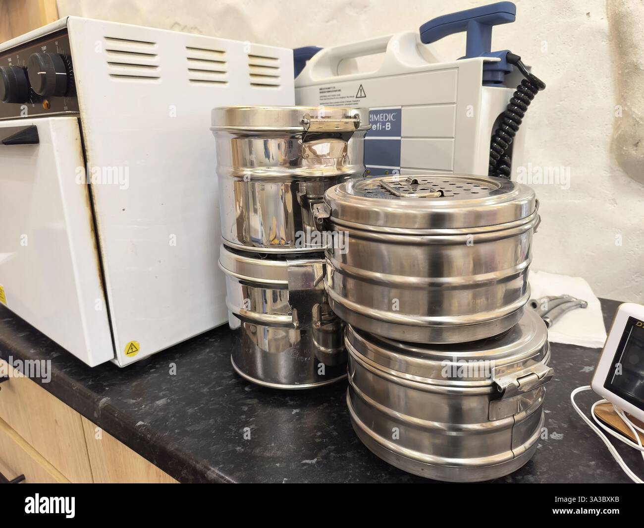 Stainless steel food containers on kitchen counter with appliances ...