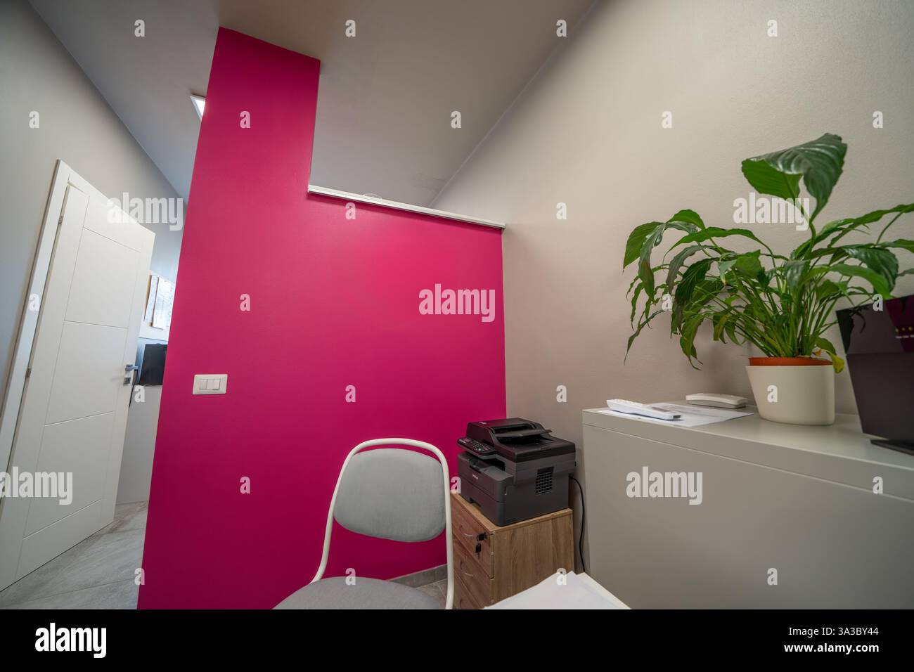 Minimalist medical reception area with clean surfaces, lighting, and ...