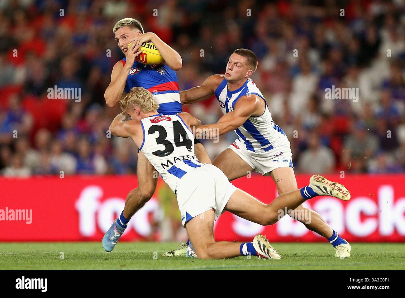 Laitham Vandermeer of the Bulldogs is tackled during the AFL Round 1 ...