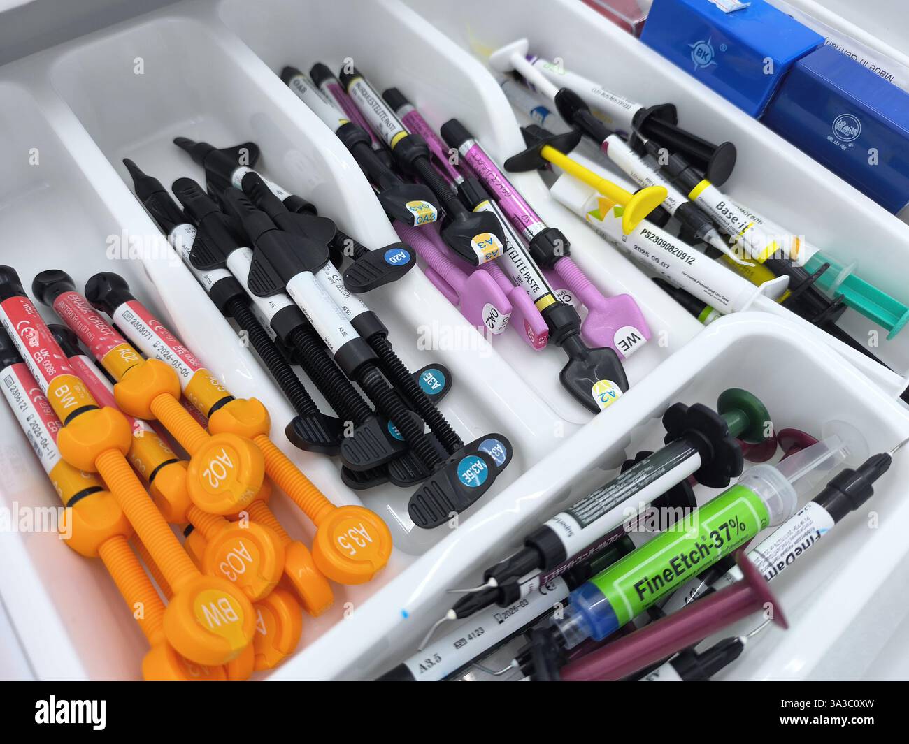 Assorted dental composite syringes and tools in organized drawer Stock ...