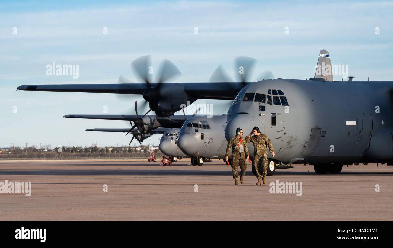 Airmen from the 317th Aircraft Maintenance Squadron prepare a C-130J ...