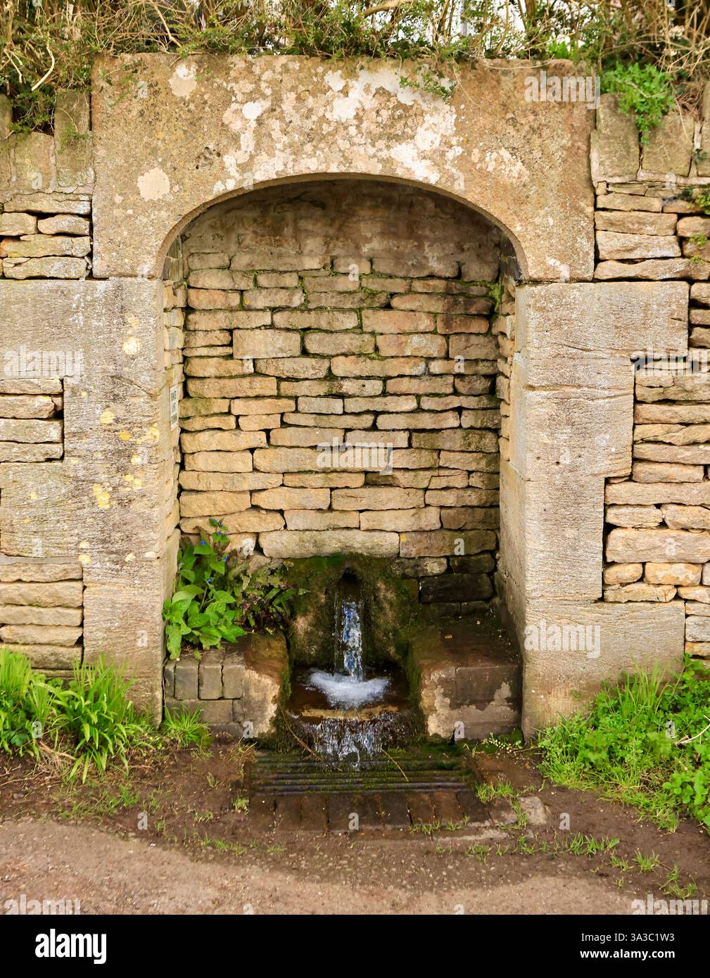 Cotswold village water feature in springtime. Box Minchinhampton Stroud ...
