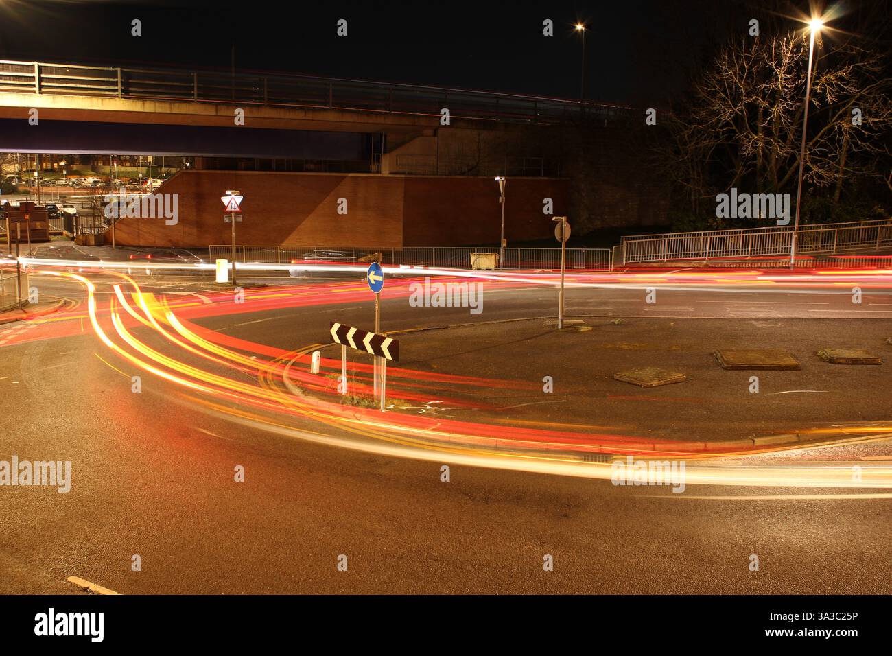 Cars and Vehicles going around the roundabout light trails Stock Photo ...