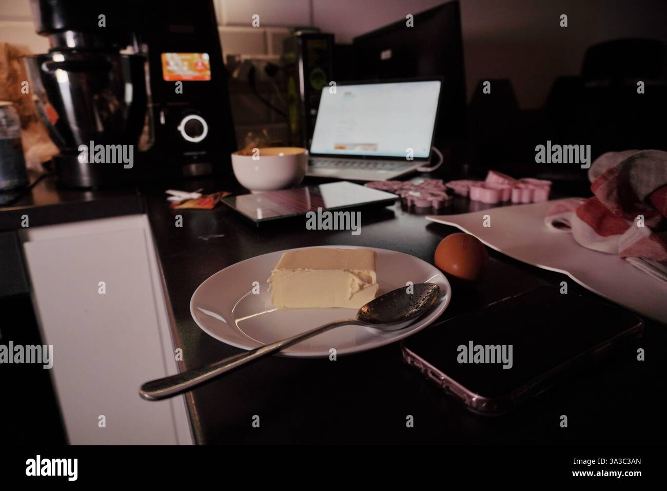 kitchen mess during cooking and baking. Close up butter, spoon, egg ...