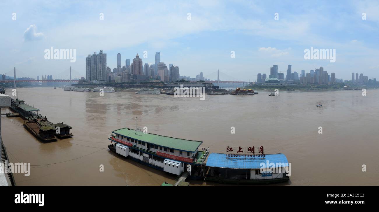 Yangtze river cruise ships and the city skyline of Chongqing in China ...