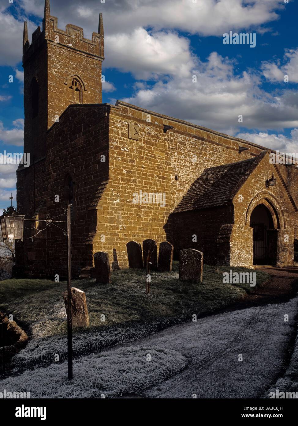 A December frost whitens the path leading to the south porch of the ...