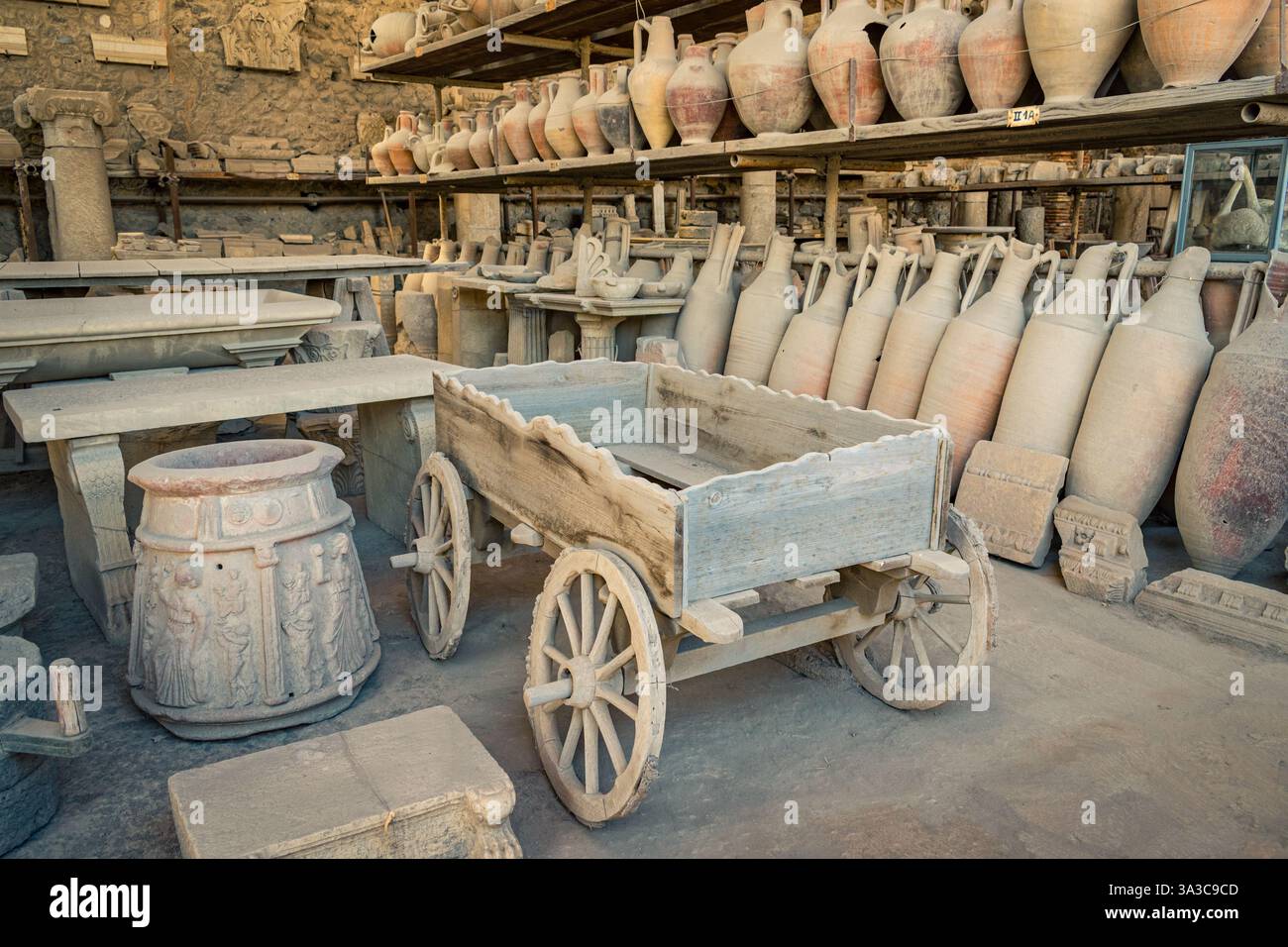 A detailed view of ancient pottery, sculptures, and artifacts in a ...
