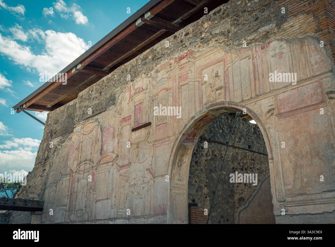 Historic architectural detail of an ancient Roman wall with frescoes in ...