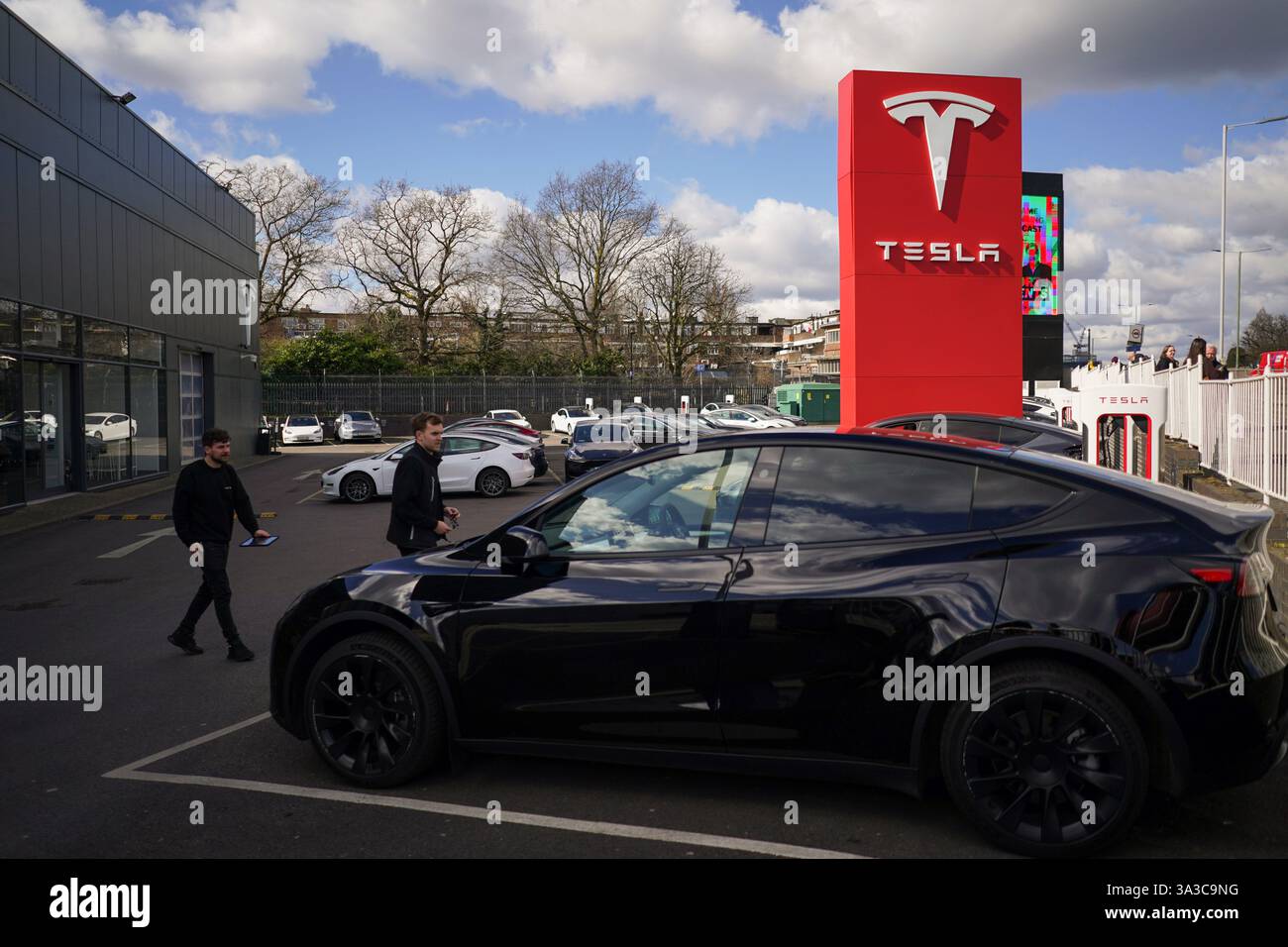General view of a Tesla dealership as a protest takes part outside, in ...