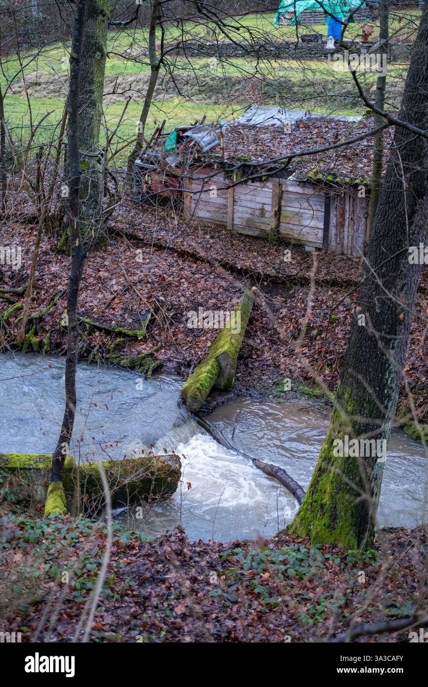 Small Dam on Forest Stream with Old Wooden Shed Stock Photo - Alamy