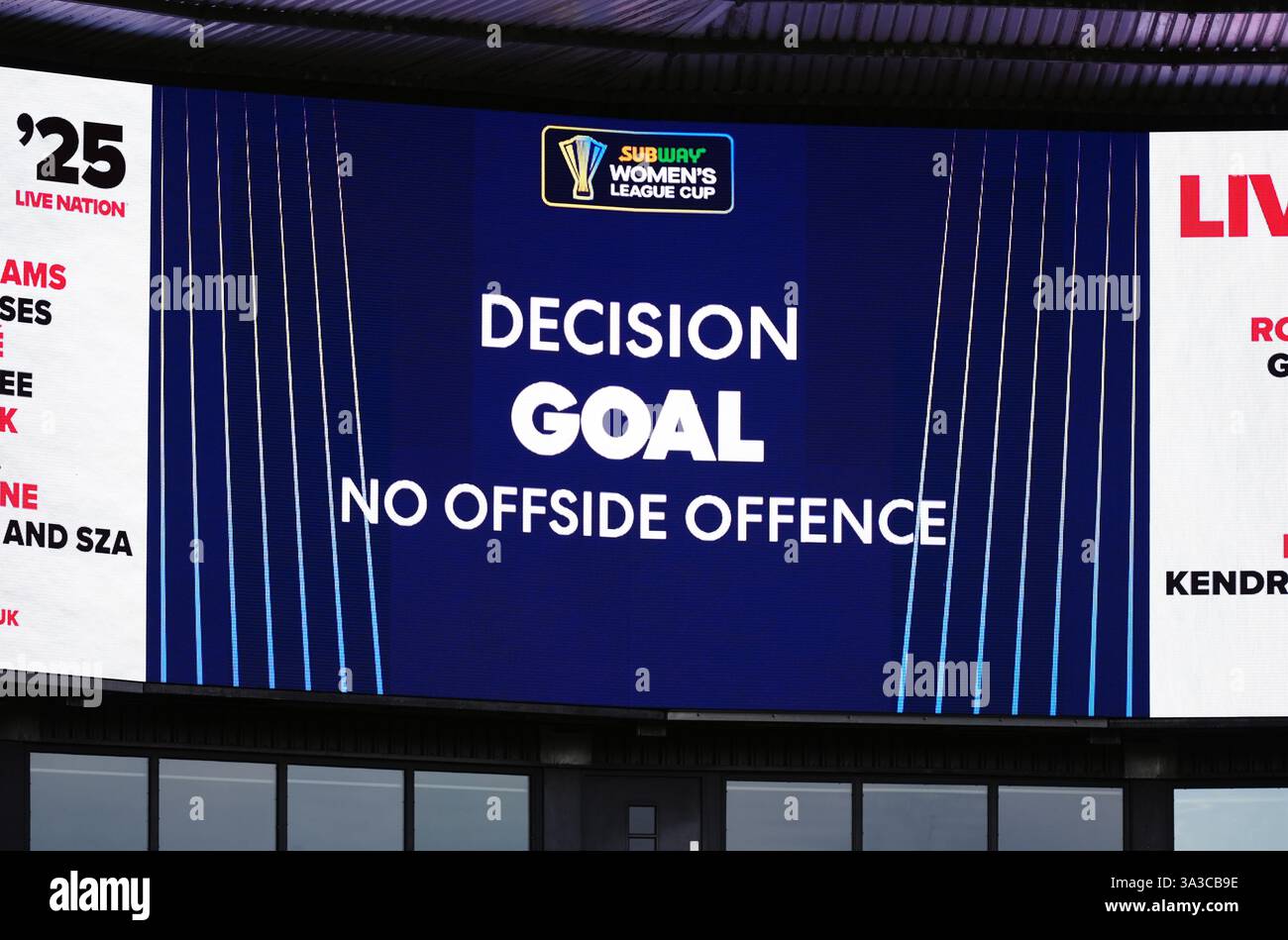 The VAR decision for no offside offence is displayed on a big screen ...