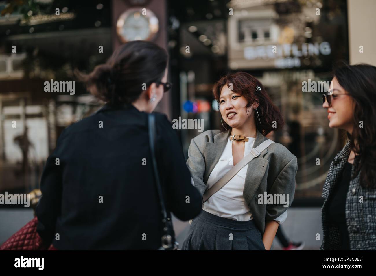 Business people engaged in conversation outdoors downtown Stock Photo ...
