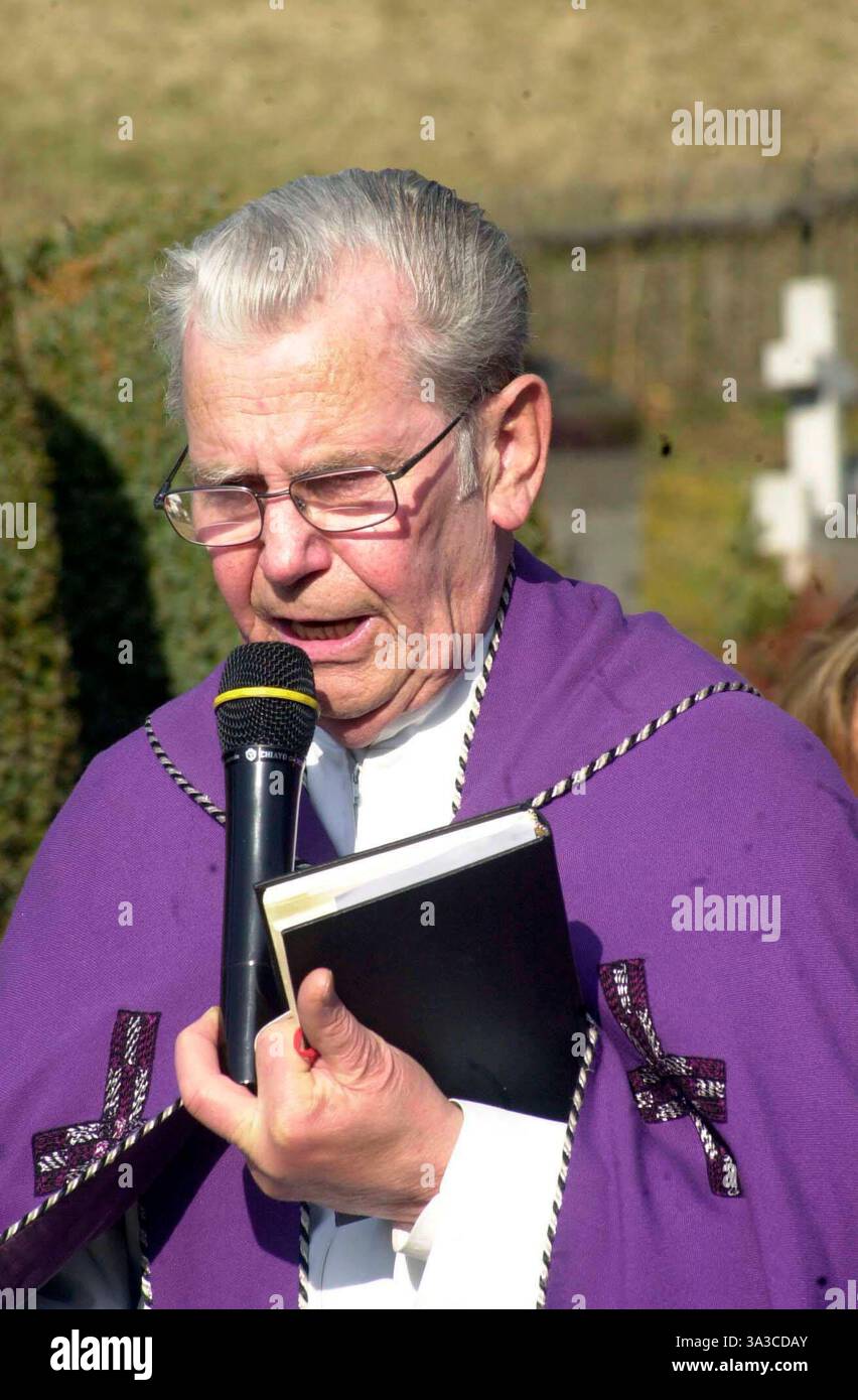 RECORD DATE NOT STATED a priest in priest robe folding his hands for ...