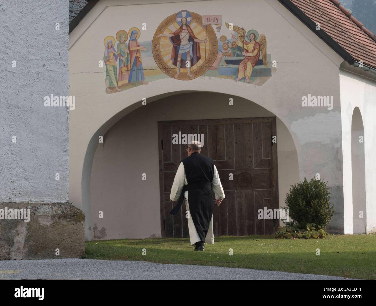 a roman catholic priest, a religious leader in christian religion roman ...