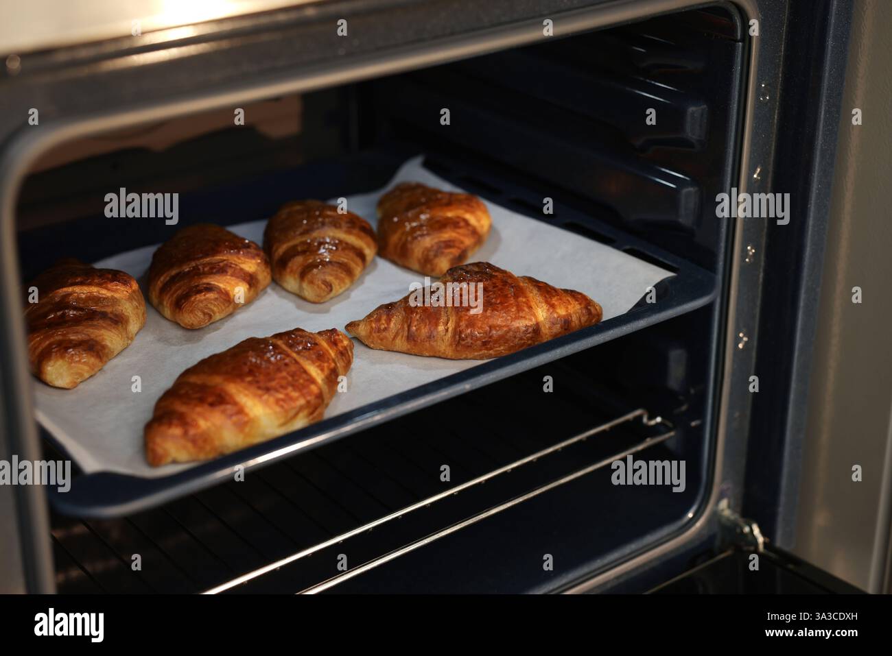 Process baking croissants in oven hi-res stock photography and images ...