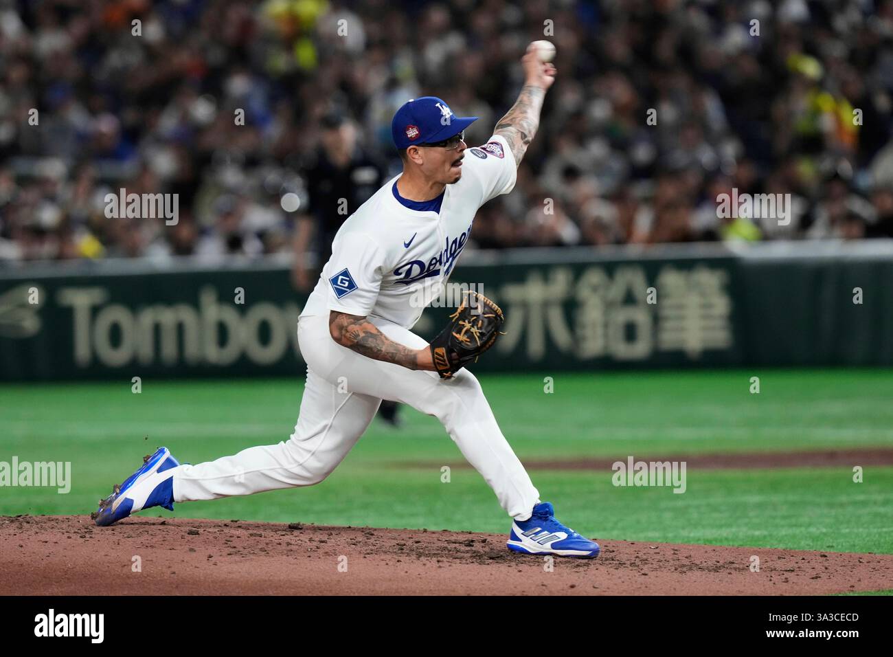 Los Angeles Dodgers' Anthony Banda throws to the Yomiuri Giants in the ...