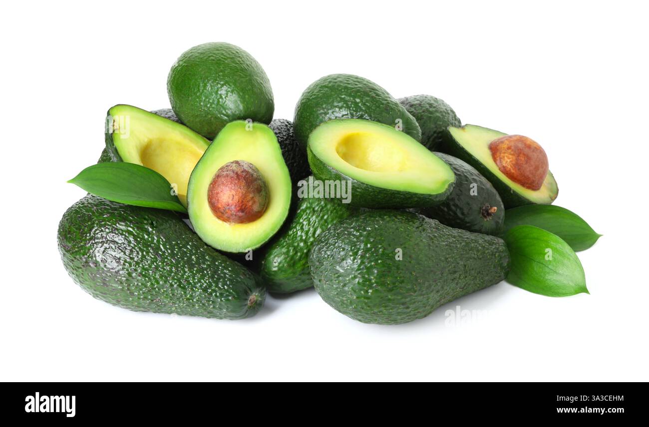Many whole and cut avocados isolated on white Stock Photo - Alamy